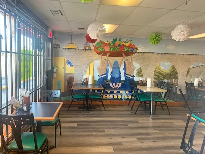 A mural that tells stories while you eat, complete with festive decorations that make every meal feel like a celebration.