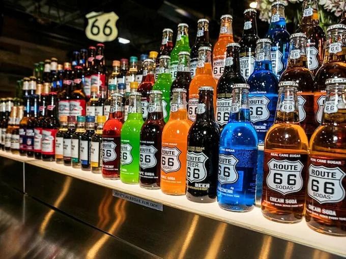 Sip on liquid nostalgia with these colorful Route 66 sodas. It's like tasting a rainbow of road trip memories!