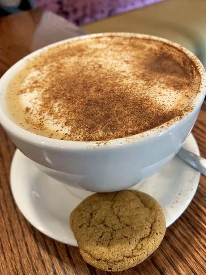 This isn't just any chai latte. It's a warm hug in a cup, complete with a cookie sidekick. 