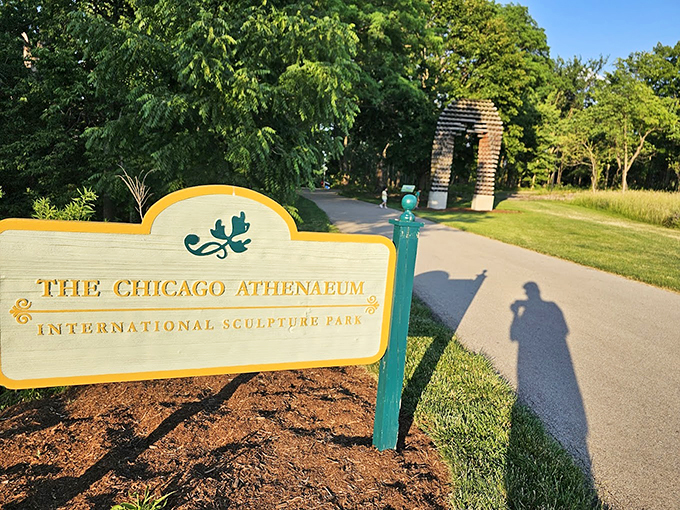 Welcome to where art meets nature—the park's entrance sign promises adventures that lie just beyond the bend.