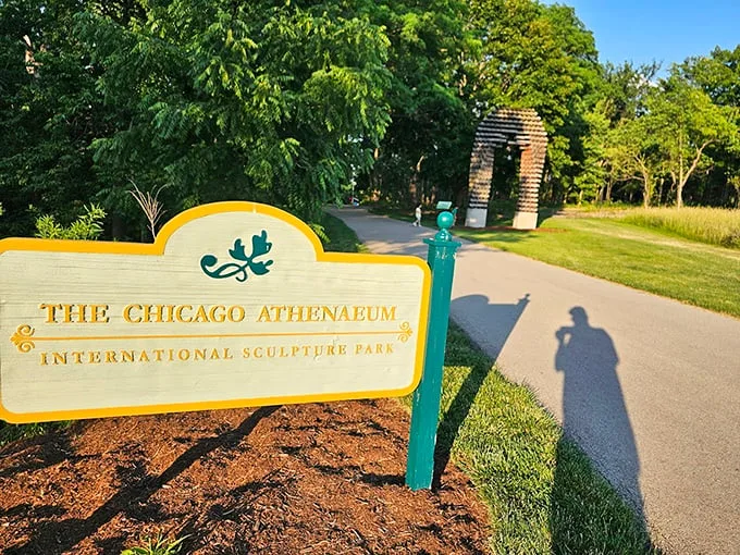 Welcome to where art meets nature—the park's entrance sign promises adventures that lie just beyond the bend.