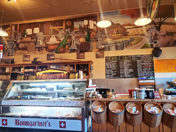 Sensory overload incoming! The interior is a delightful mishmash of local memorabilia and enough cheese varieties to make a mouse weep with joy.