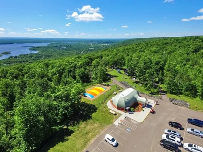 Lake views and loop-de-loops – because why choose between scenic and screaming? Spirit Mountain says, "Why not both?"
