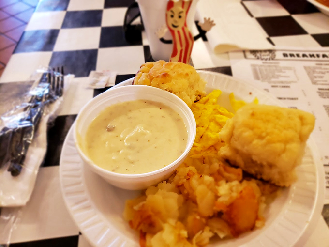 Behold, the holy trinity of comfort: biscuits, gravy, and hash browns. This plate is a warm hug for your taste buds.