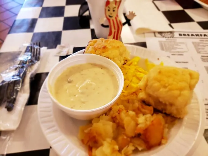 Behold, the holy trinity of comfort: biscuits, gravy, and hash browns. This plate is a warm hug for your taste buds.