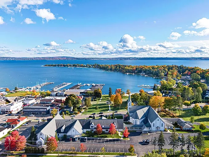 A bird's-eye view that'll make you want to spread your wings! Harbor Springs unfolds like a picturesque pop-up book, complete with sparkling waters and autumn-kissed trees.