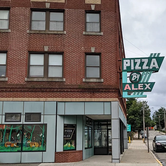 Step into a time warp! Pizza by Alex's vintage sign promises a slice of nostalgia with every bite.