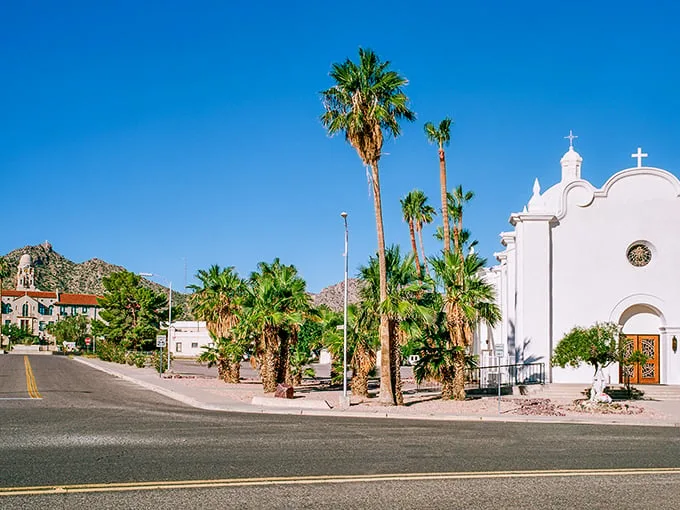 Welcome to Ajo, where Spanish colonial charm meets the Wild West! Palm trees and cacti stand guard over this architectural gem nestled in the Sonoran Desert. Photo credit: LXG_Photos