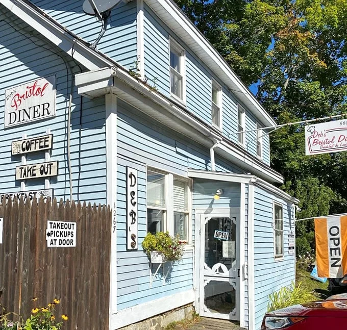 Like a cozy blue lighthouse guiding hungry souls to breakfast paradise, Deb's Bristol Diner stands ready to welcome early risers and brunch enthusiasts alike.