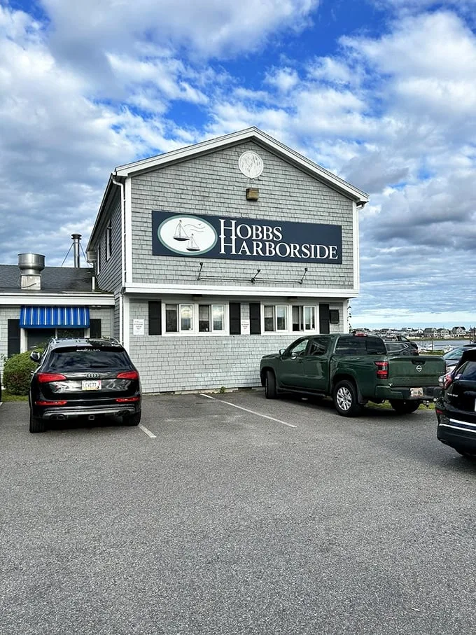 The gray-shingled beacon of seafood salvation stands proud against Maine's moody sky, beckoning hungry souls with its promise of maritime delights.
