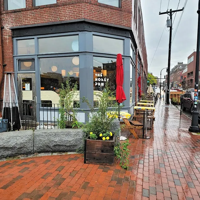The Honey Paw's corner spot in Portland beckons with its sleek gray exterior and cheerful yellow signage, like a modern-day beacon for hungry souls. Photo credit: Shanah Bell