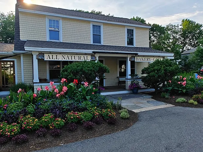 A charming yellow colonial house transformed into carb heaven, where flowers bloom and bread rises in perfect harmony. Photo credit: Mark Heydenburg
