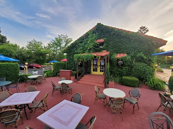 The ivy-covered exterior and charming patio create a secret garden vibe that makes you forget you're in Carpentersville.