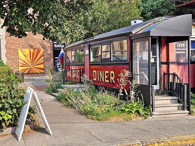 A vintage Pollard dining car from 1927 stands proudly in Biddeford, its red exterior and gold lettering promising delicious adventures within.