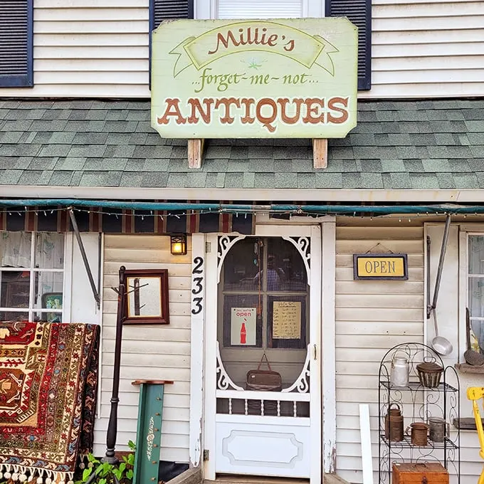 The charming storefront of Millie's beckons with its vintage sign and screen door – like stepping into your favorite nostalgic movie set.