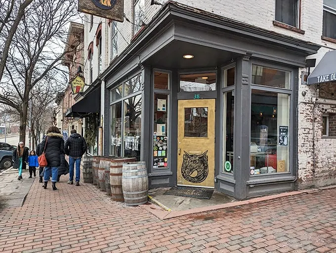 Step right up to the Mule Bar, where the golden door beckons like a portal to comfort food paradise. This unassuming facade hides a world of culinary delights waiting to be discovered.