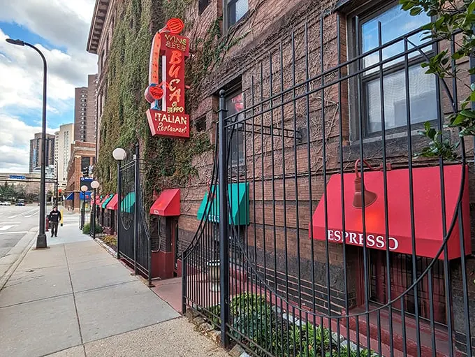 Mama mia! This brick facade isn't just a wall – it's a portal to pasta paradise. Red awnings and ivy whisper promises of cozy Italian feasts within.