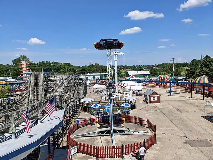 Welcome to Little Amerricka, where nostalgia meets thrills! This bird's-eye view showcases a charming tapestry of classic rides and Americana charm.