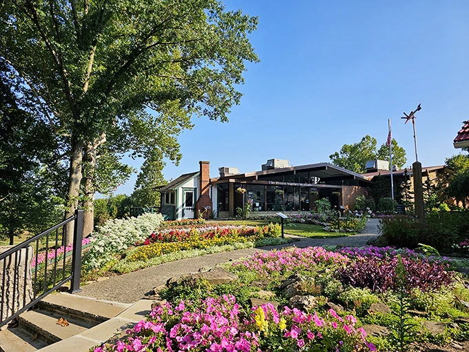 Welcome to woodcarving wonderland! The Warther Museum's vibrant gardens are like a colorful appetizer before the main course of miniature marvels inside.