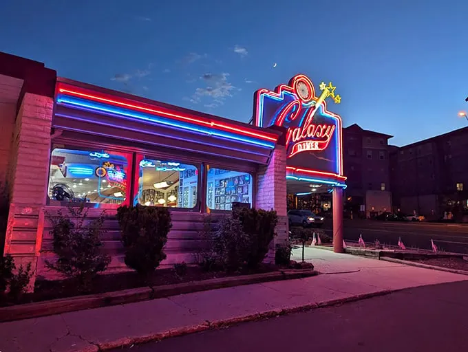 Neon dreams come alive! The Galaxy Diner's sign blazes against the twilight sky, a beacon of nostalgia that would make even the Fonz say