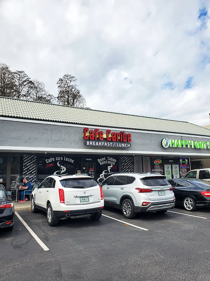 Welcome to flavor town! Cafe Caribe's unassuming exterior hides a world of culinary delights, proving that sometimes the best things come in strip mall packages. Photo credit: DANILO ROJAS