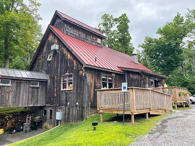 A red-roofed haven of maple-infused delights! This charming wooden structure is where breakfast dreams come true and syrup flows like liquid gold.
