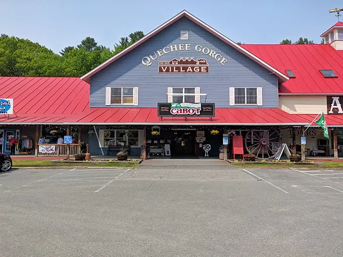 Step right up to nostalgia central! This charming blue-and-red facade isn't just a building—it's a time machine disguised as the Quechee Gorge Village.
