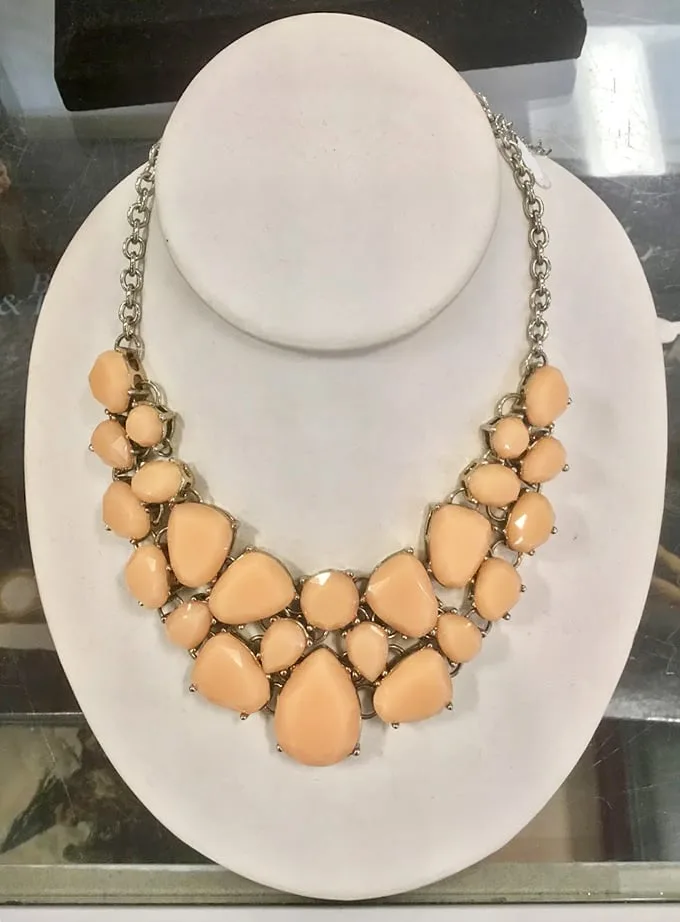 Statement piece alert! This necklace isn't just an accessory – it's a conversation starter that whispers, "I've got great taste and savvy shopping skills."
