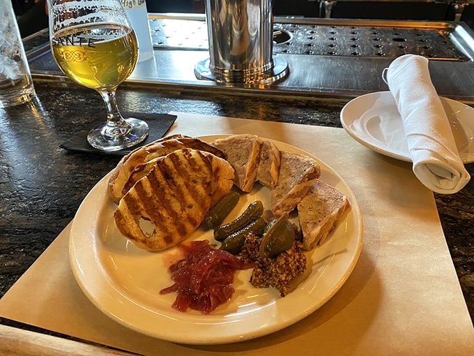 A plate that screams "Ooh la la!" Pâté, pickles, and perfectly toasted bread—it's like a French picnic decided to crash your dinner plans.