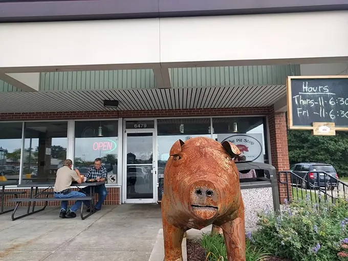 The Pit Stop: Where every day is hog heaven! This unassuming storefront guards smoky secrets that'll make your taste buds race.