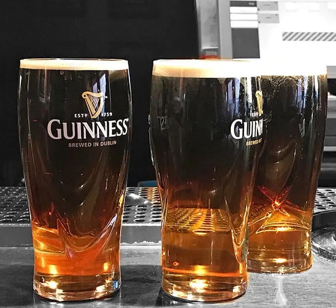 The perfect pour, times two! These Guinness pints are so photogenic, they could star in their own foam-umentary.