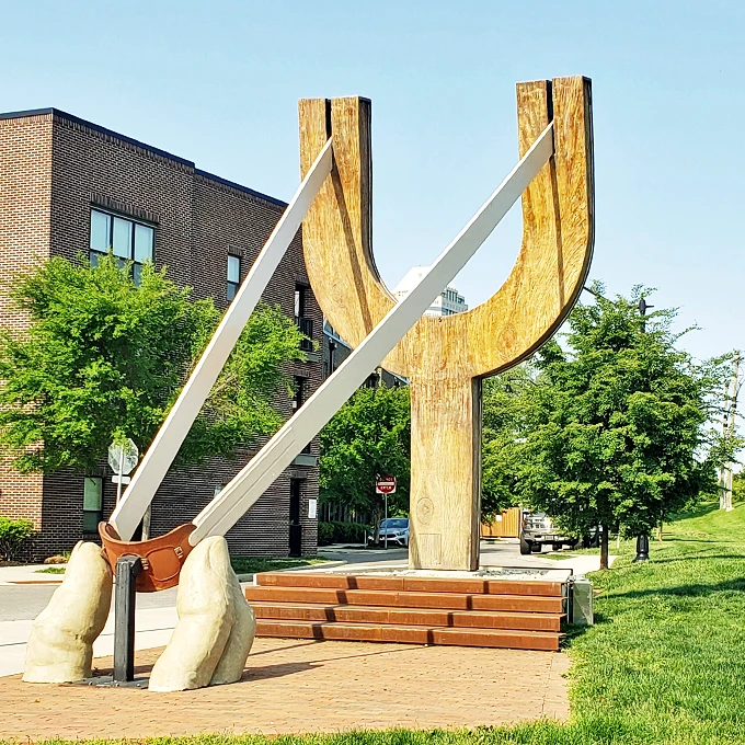 Front and center, this slingshot demands attention. It's the selfie spot that says, "I came, I saw, I posed with a giant wooden Y."
