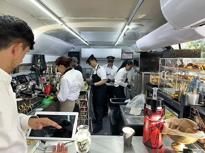The crew works with the precision of air traffic controllers to craft perfect beverages in this compact galley kitchen.