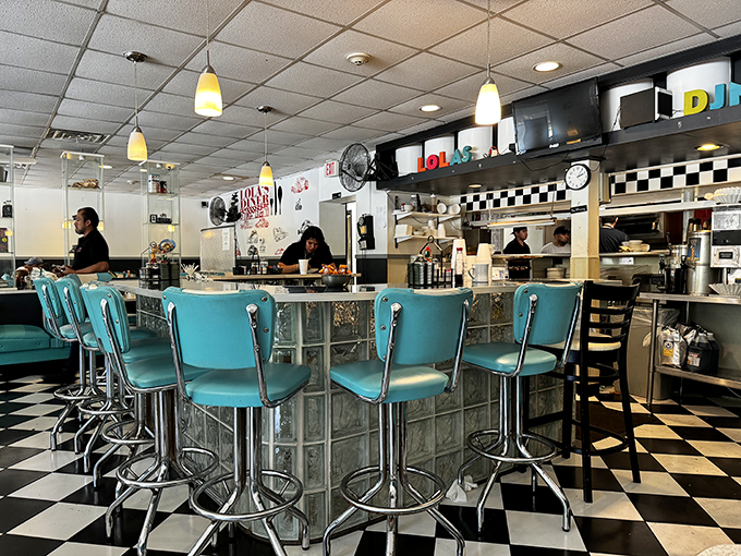 The heart of Lola's – where magic happens and calories don't count. Watch the short-order symphony unfold before your eyes.