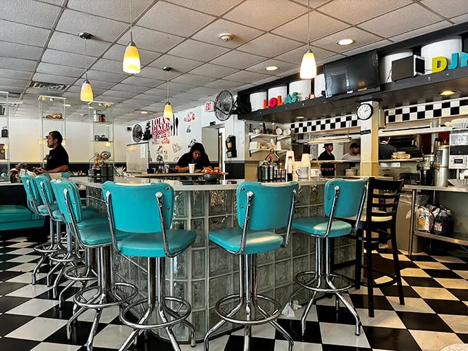 The heart of Lola's – where magic happens and calories don't count. Watch the short-order symphony unfold before your eyes.