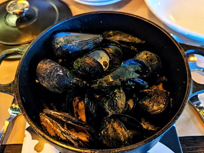 Mussels, oh my! These little ocean gems are steamed to perfection, ready to transport your taste buds to a seaside café in the Mediterranean.