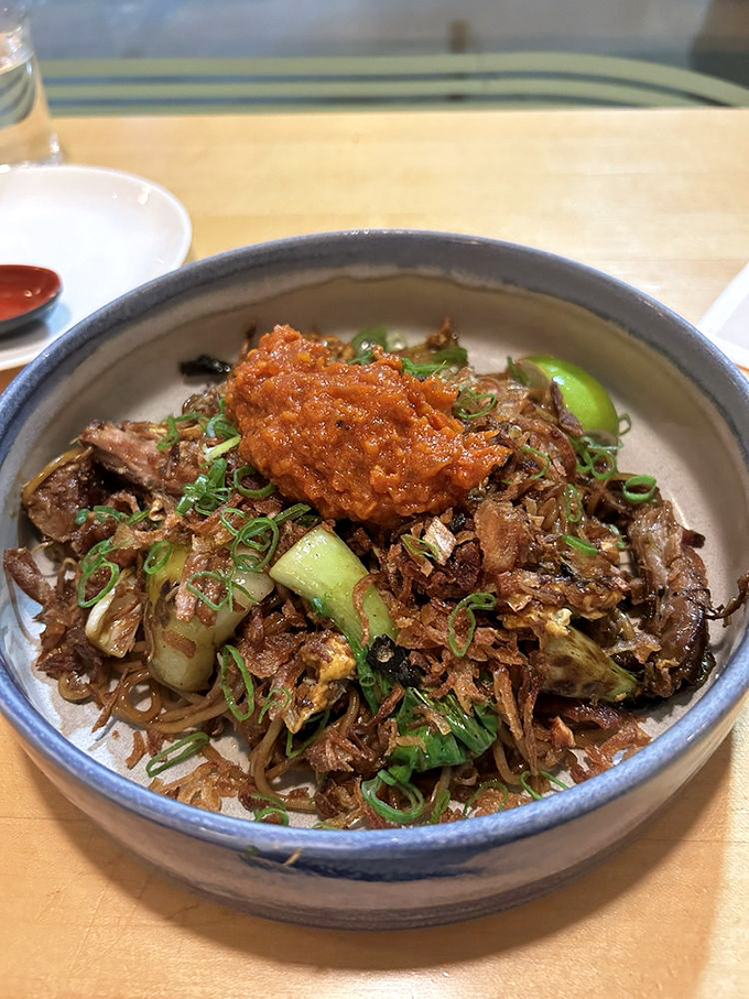 This mee goreng brings the heat and the sweet, topped with what appears to be a crispy crown. Photo credit: Andrea R.