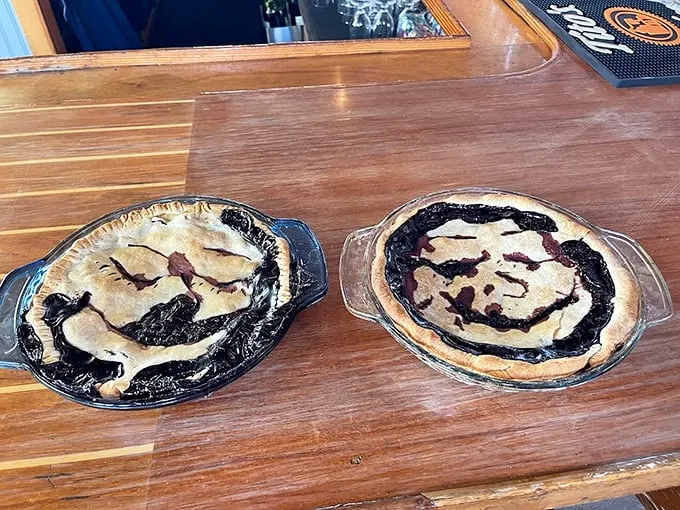 These pies look like they're smiling at you - and after one bite of Maine's wild blueberry filling, you'll be smiling back. Photo credit: Archer's on the Pier