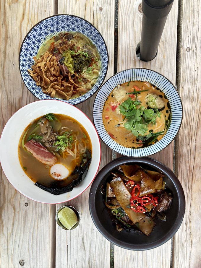 A feast for both eyes and stomach – four different noodle dishes showcase The Honey Paw's range of Asian flavors. Photo credit: Sheryl C.