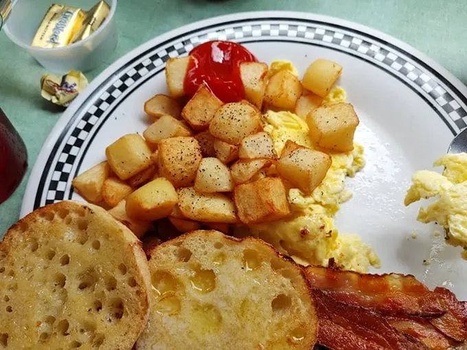 The holy trinity of breakfast: eggs, bacon, and toast. It's like a edible sunrise on your plate!