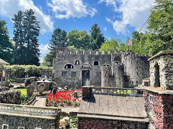 Pebble-powered whimsy! This miniature stone kingdom proves one man's rocks are another's fairytale castle. Flintstones, eat your heart out!