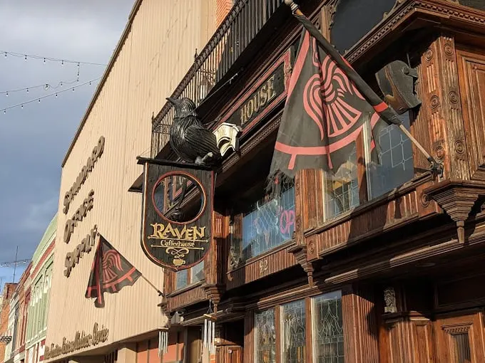 Quoth the raven, "Have some more!" This bookish café serves up atmosphere thicker than Dickens and coffee darker than Poe's tales. Photo credit: Hunny "Hun" Howe