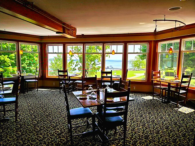 Sunlight streams through wraparound windows, offering diners stunning views of Frenchman Bay alongside their fresh-caught feast. Photo credit: Sasha Voinov