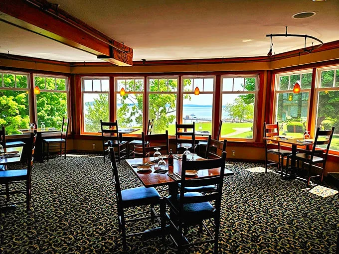 Sunlight streams through wraparound windows, offering diners stunning views of Frenchman Bay alongside their fresh-caught feast. Photo credit: Sasha Voinov