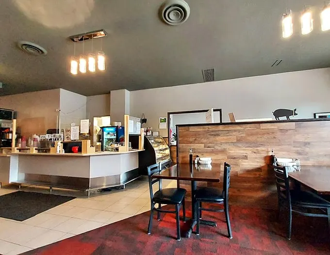 Step into a cozy breakfast nook that's part modern diner, part your grandma's kitchen – minus the plastic-covered furniture.