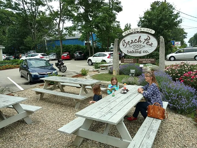 The outdoor picnic tables, surrounded by lavender and summer blooms, offer the perfect spot to savor your freshly baked treasures. Photo credit: Ezra Casas