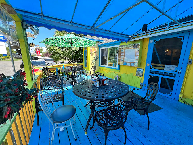 Outdoor seating that's more 'Alice in Wonderland' than 'Up North Michigan'. This patio is where summer memories are made, one colorful chair at a time.