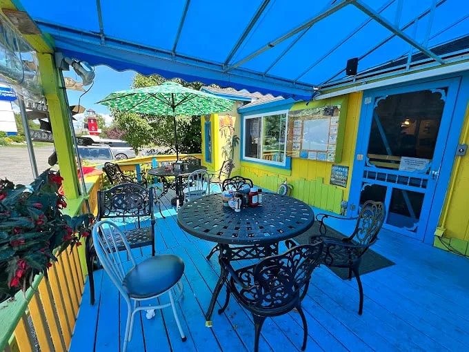 Outdoor seating that's more 'Alice in Wonderland' than 'Up North Michigan'. This patio is where summer memories are made, one colorful chair at a time.