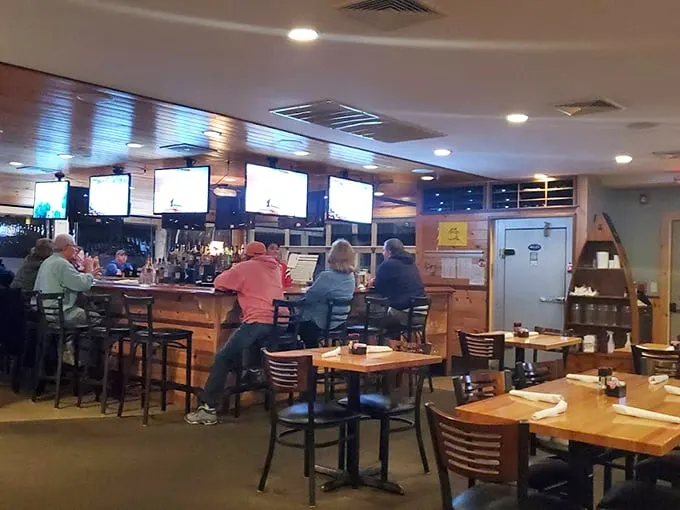 Where Patriots fans and seafood lovers unite: Multiple screens, a well-stocked bar, and Boston sports memorabilia create the quintessential Maine experience. Photo credit: Walter Pedro Moura