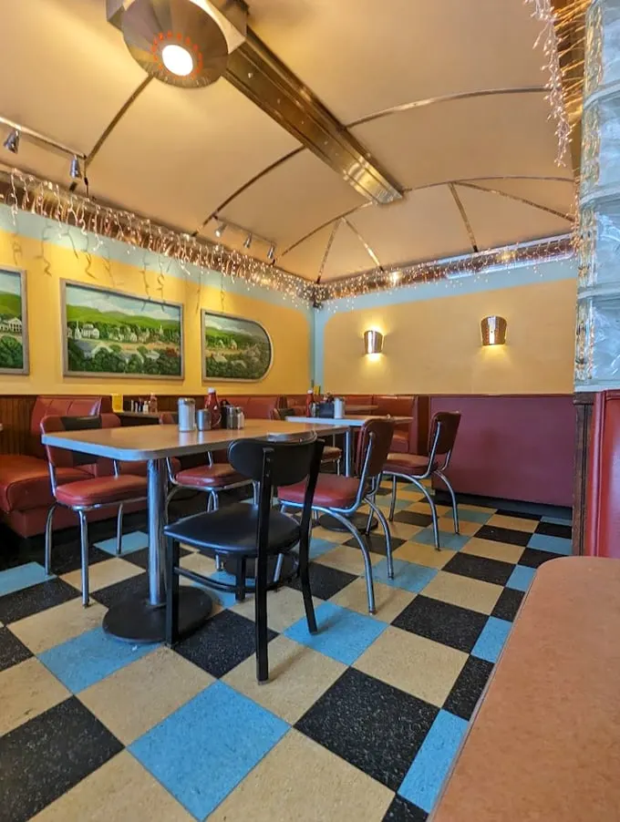 Checkered floors and cozy booths: the natural habitat of the elusive 'perfect breakfast.' Can you spot it in its native environment?